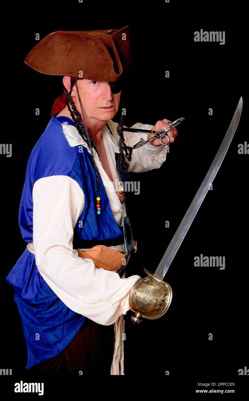 Pirate isolated on black with a cutless Stock Photo - Alamy