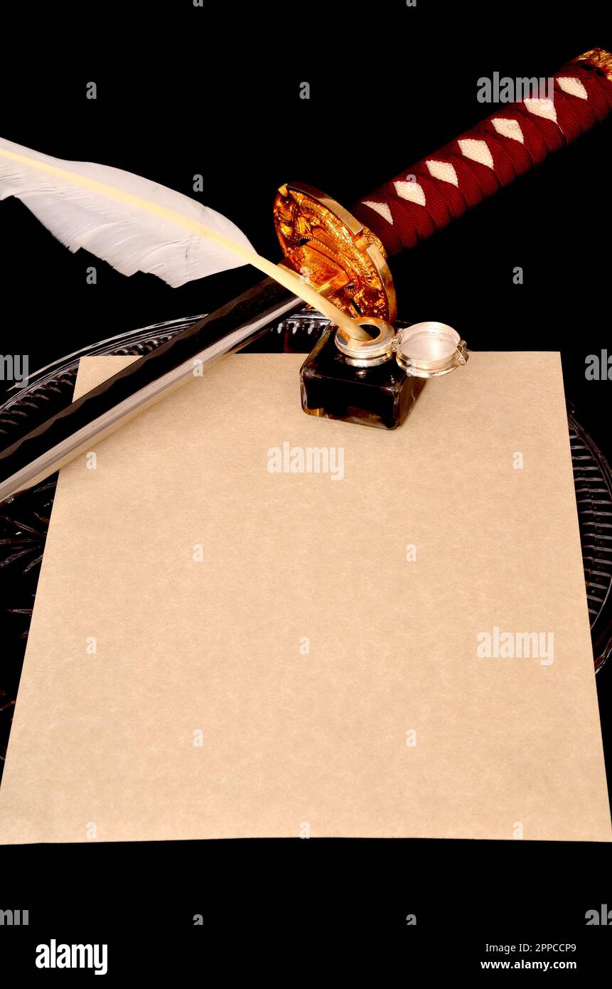 Quill parchment sword and ink well isolated over black Stock Photo - Alamy