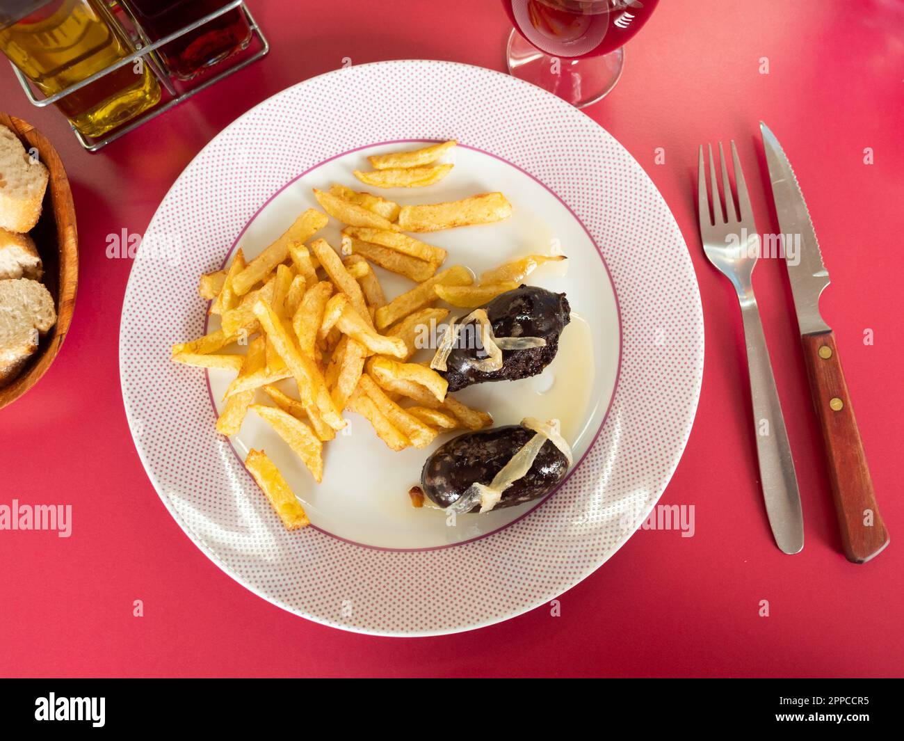 main course is fried fatty blood sausage with bow and slices of french ...
