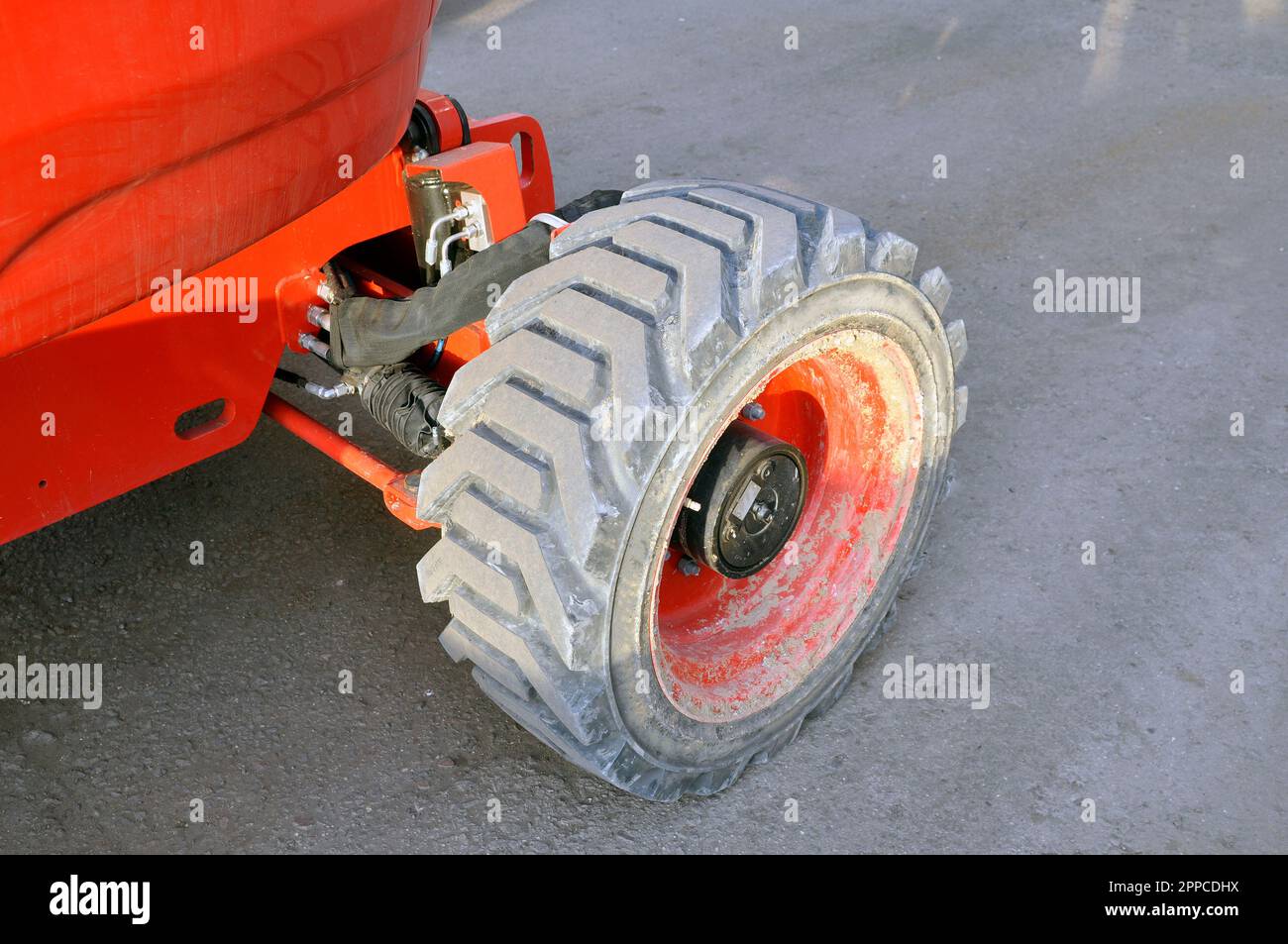Driving wheel of a self-propelled construction hoist Stock Photo - Alamy