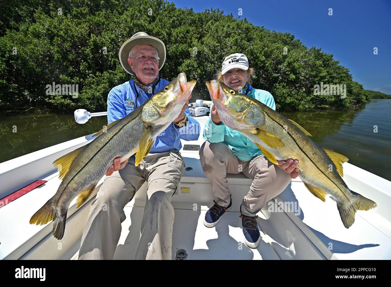 An angler admires a nice catch from the flats and islands off Crystal ...