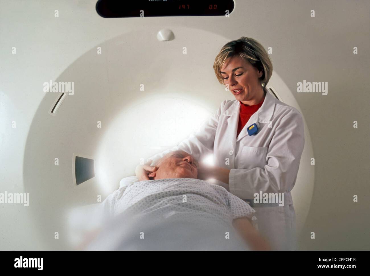 Technician preparing a senior man for an MRI Stock Photo - Alamy