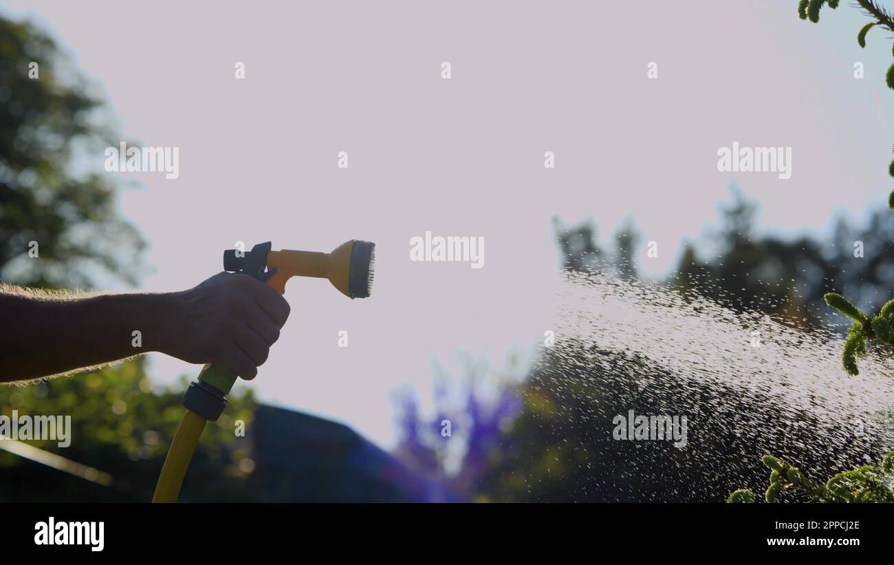 Water sprinkler on lawn slow hi-res stock photography and images - Alamy