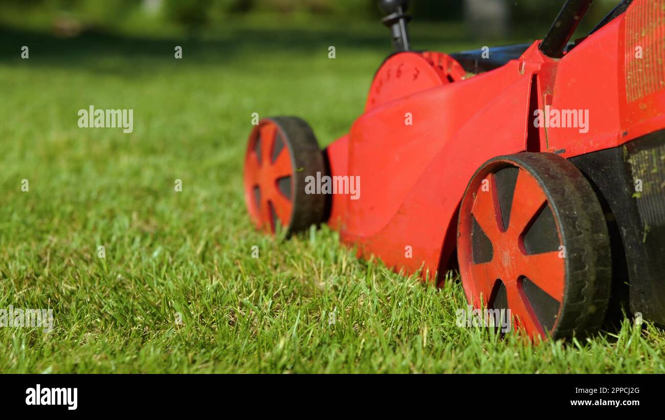 Camera following lawn mower mowing hi-res stock photography and images ...