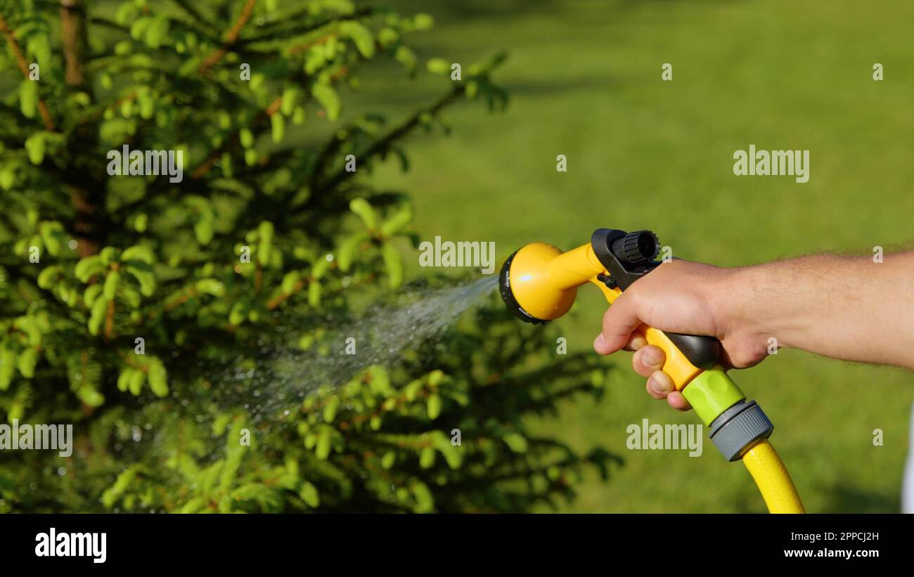 Water sprinkler spraying slow motion hi-res stock photography and ...