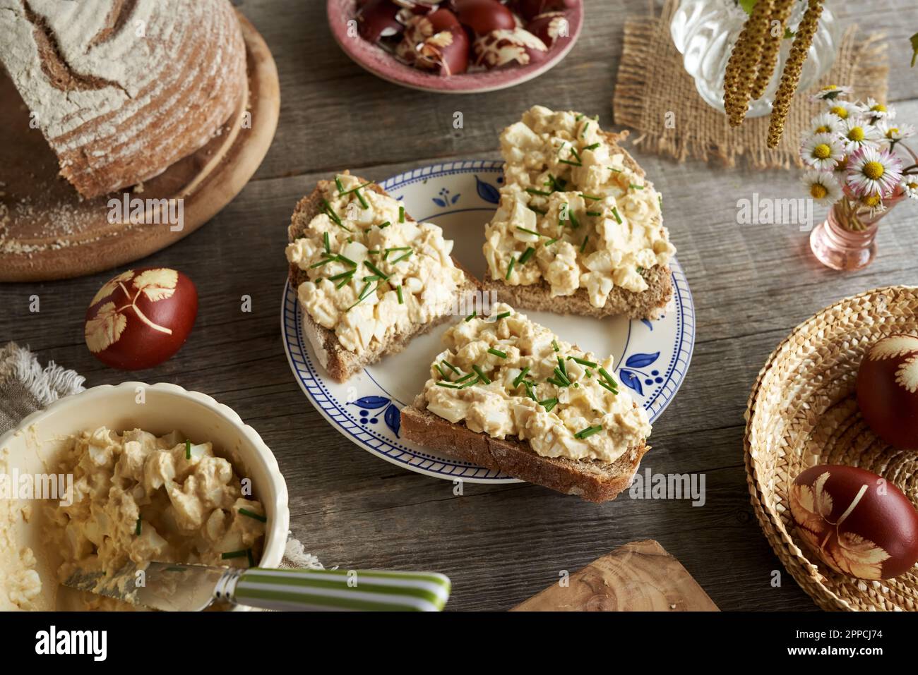 Slices of sourdough bread with spread made of hard-boiled Easter eggs ...