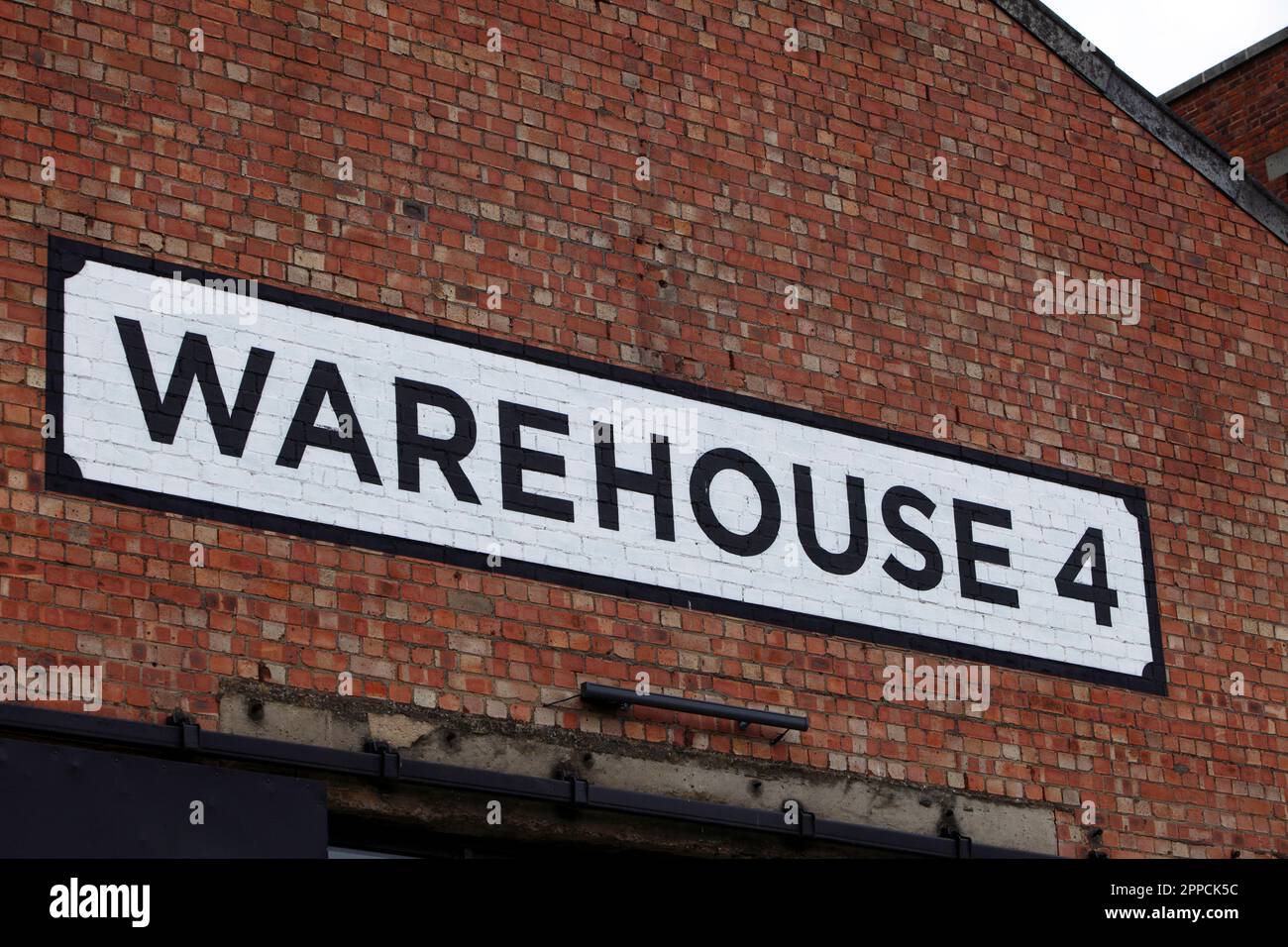 Warehouse 4 sign on a warehouse in Gloucester docks. UK Stock Photo - Alamy
