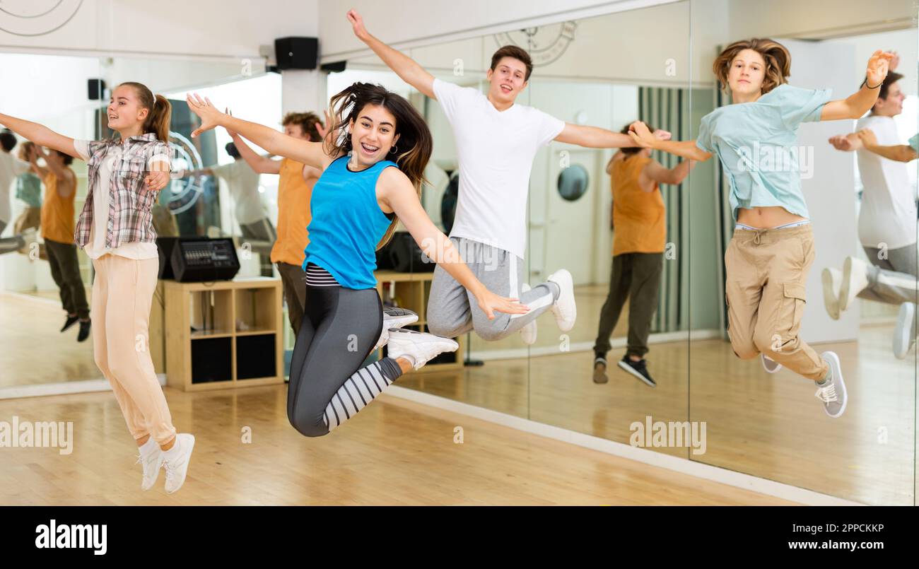 Teenagers dancers jumping in studio Stock Photo - Alamy