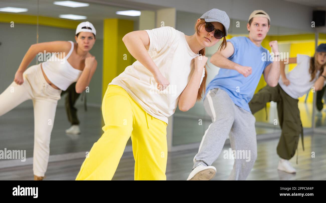 Teen girl in cap dances hip hop dances Stock Photo - Alamy