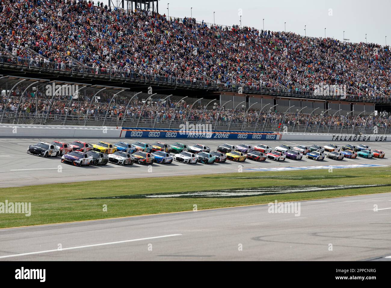 Driver Denny Hamlin (11) leads the pack to start the NASCAR Cup Series ...