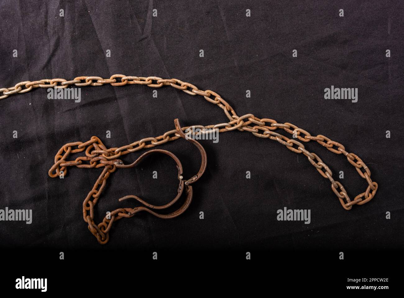 Old chains or handcuffs used to hold prisoners or slaves between 1600 ...