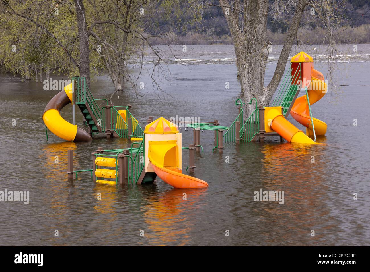 Playground equipment submerged in floodwaters during spring Stock Photo ...