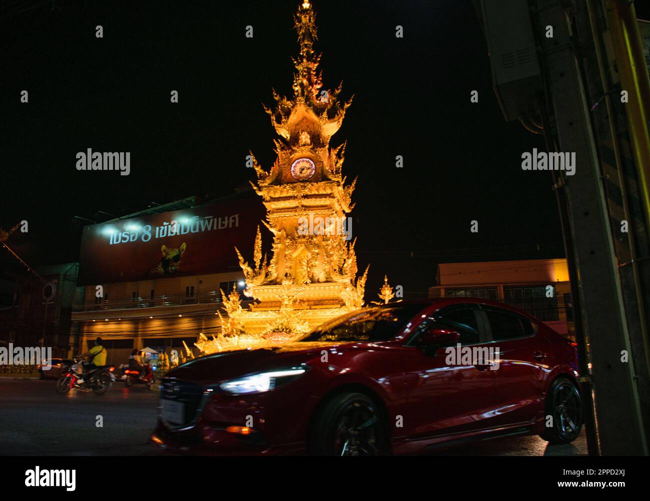 The gilded clock tower in the night at Chiang Mai Stock Photo - Alamy