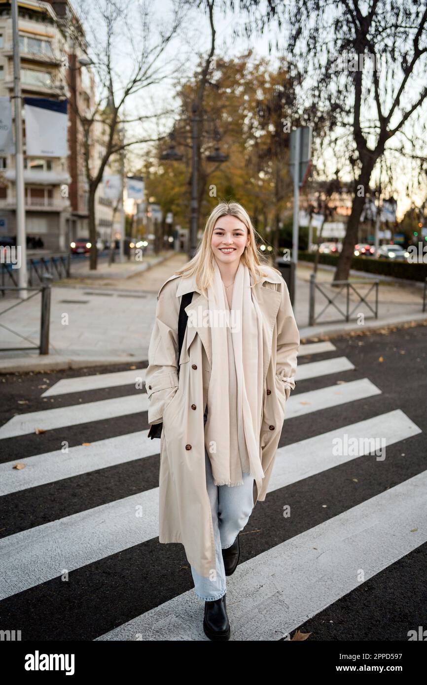 Young woman walking zebra crossing hi-res stock photography and images ...