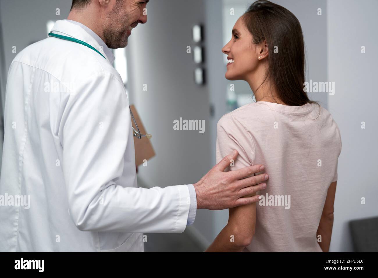 Doctor consoling women hi-res stock photography and images - Alamy