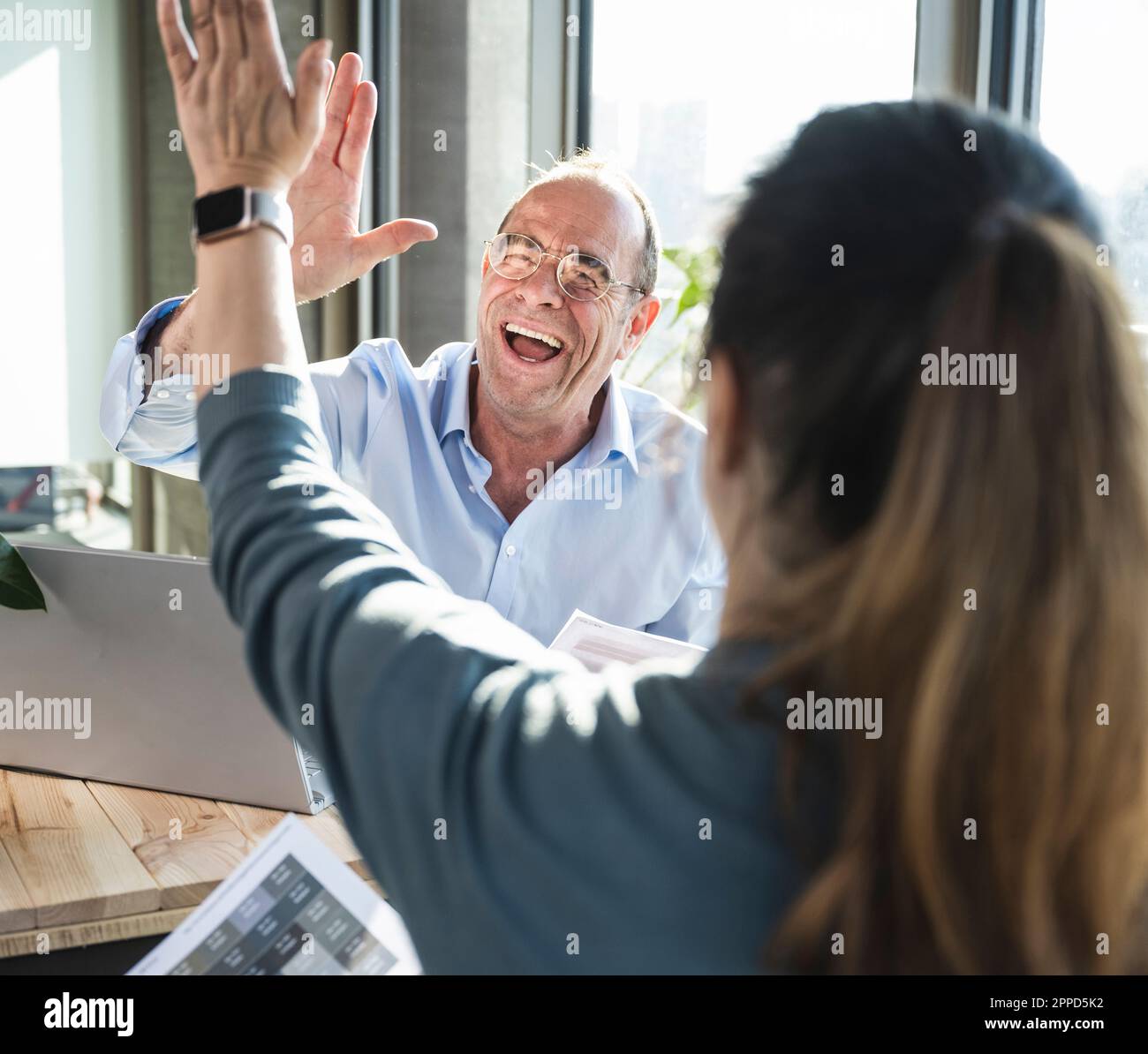 Happy high five mature hi-res stock photography and images - Alamy