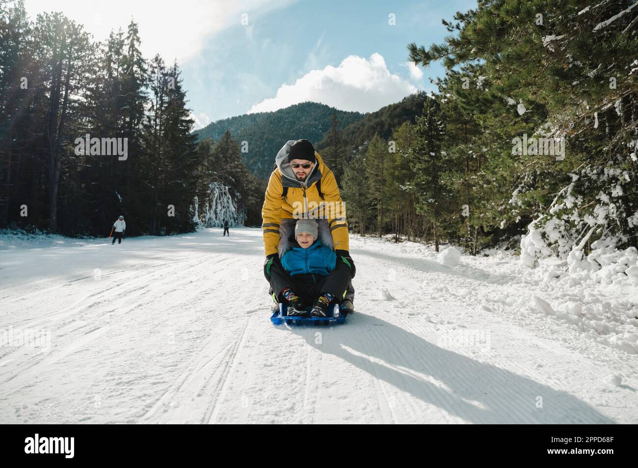 Child boy sledding in hi-res stock photography and images - Alamy