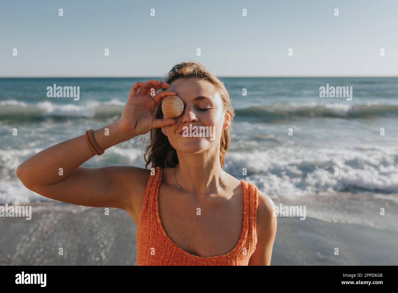 Woman and seashell hi-res stock photography and images - Alamy