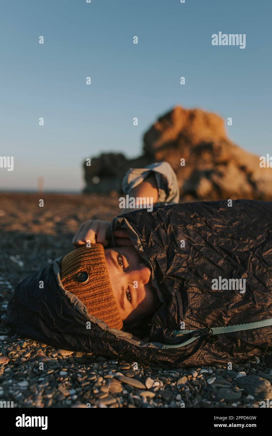 Woman sleeping on beach hi-res stock photography and images - Alamy