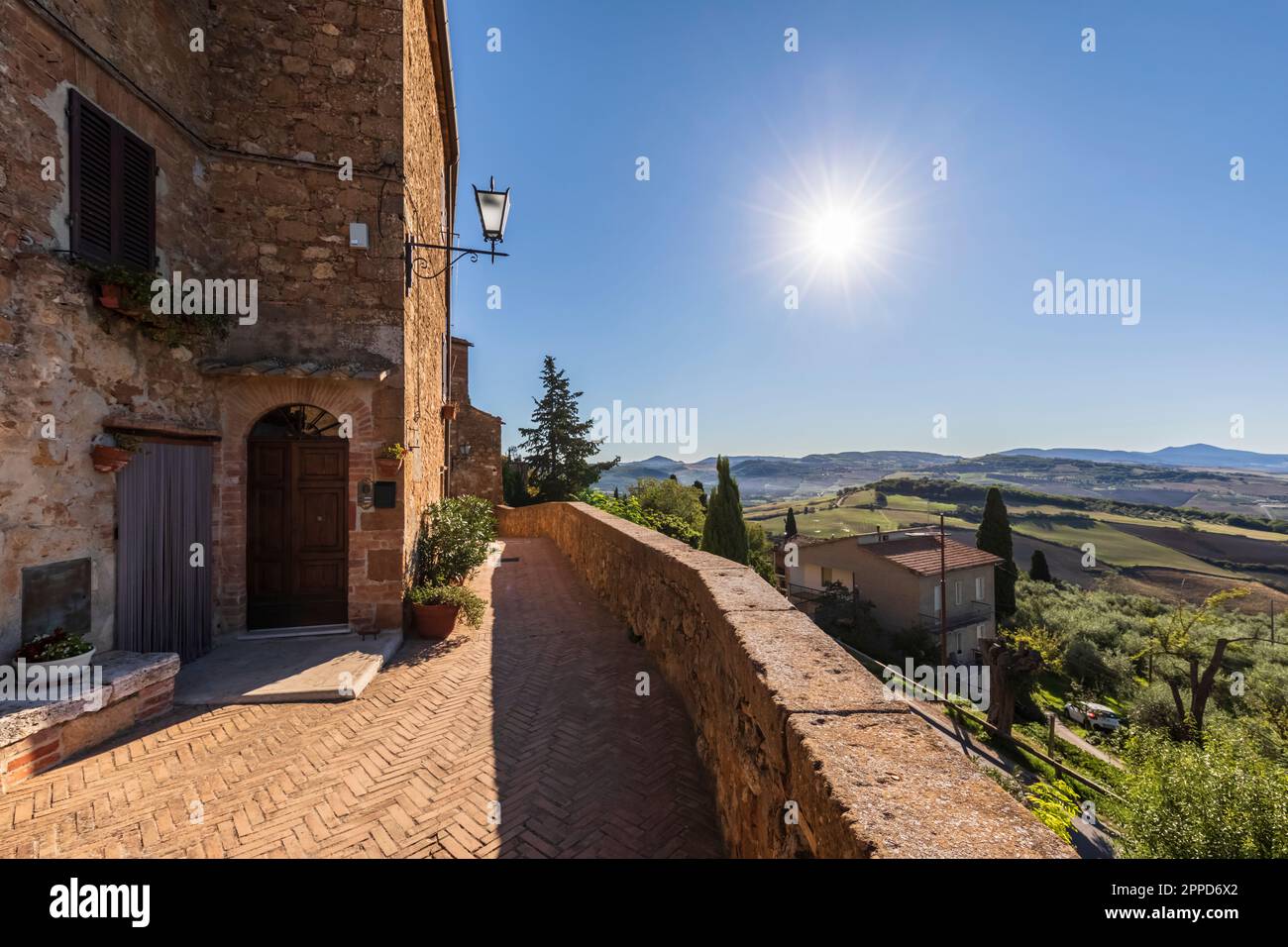 Italy, Tuscany, Pienza, Sun shining over edge of historic town Stock ...