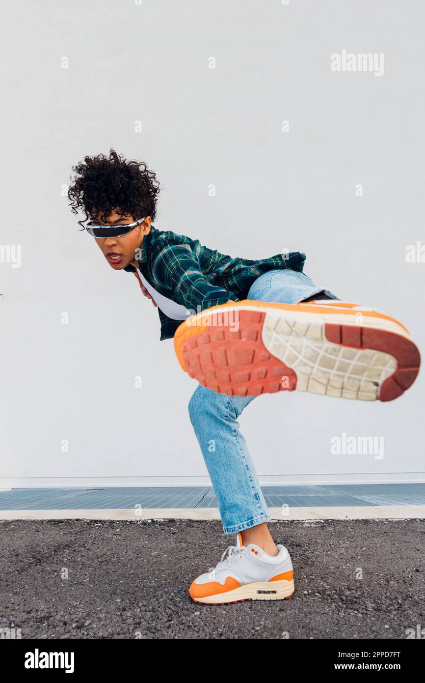 Woman kicking leg hi-res stock photography and images - Alamy