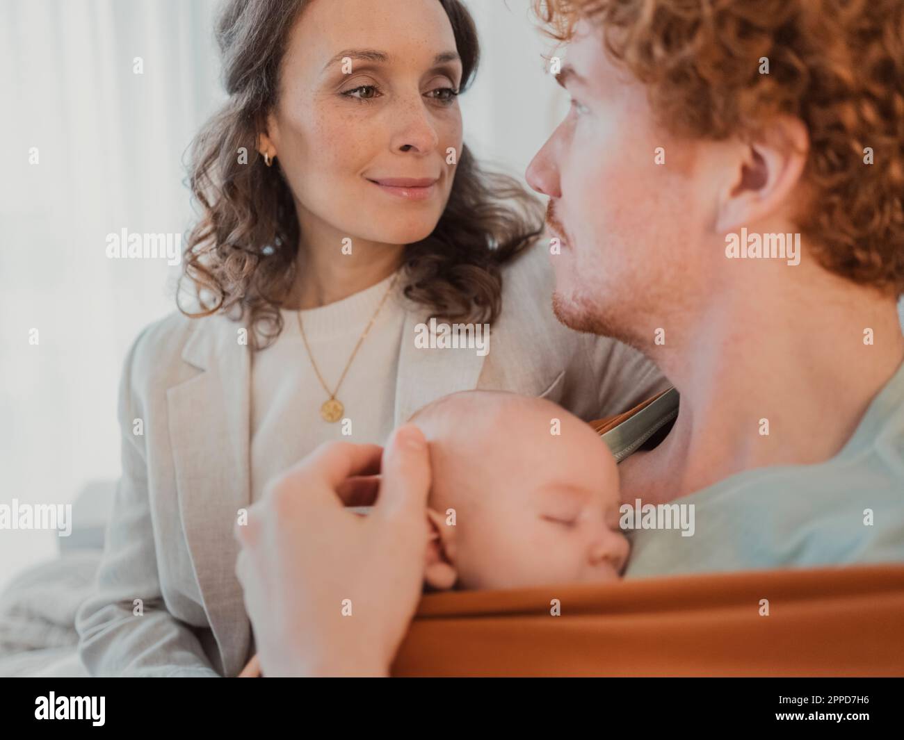 Man embracing baby hi-res stock photography and images - Alamy