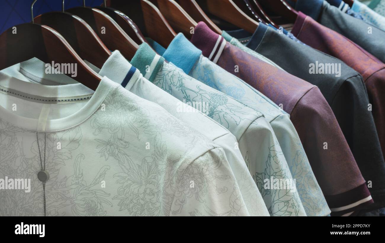 Fashion clothes on clothing rack Closeup of rainbow color choice of ...