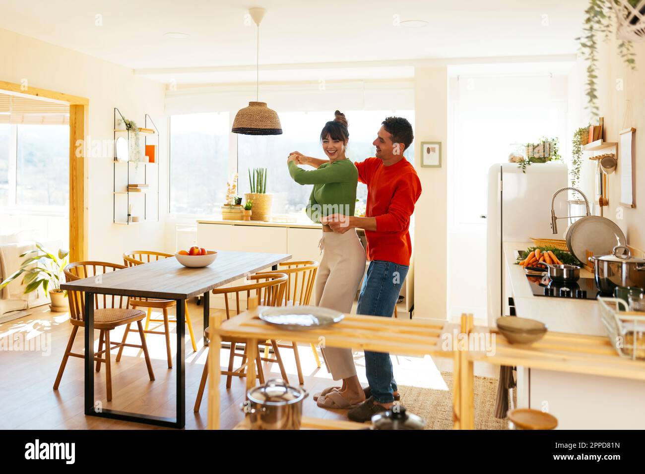 Woman dancing in light kitchen hi-res stock photography and images - Alamy