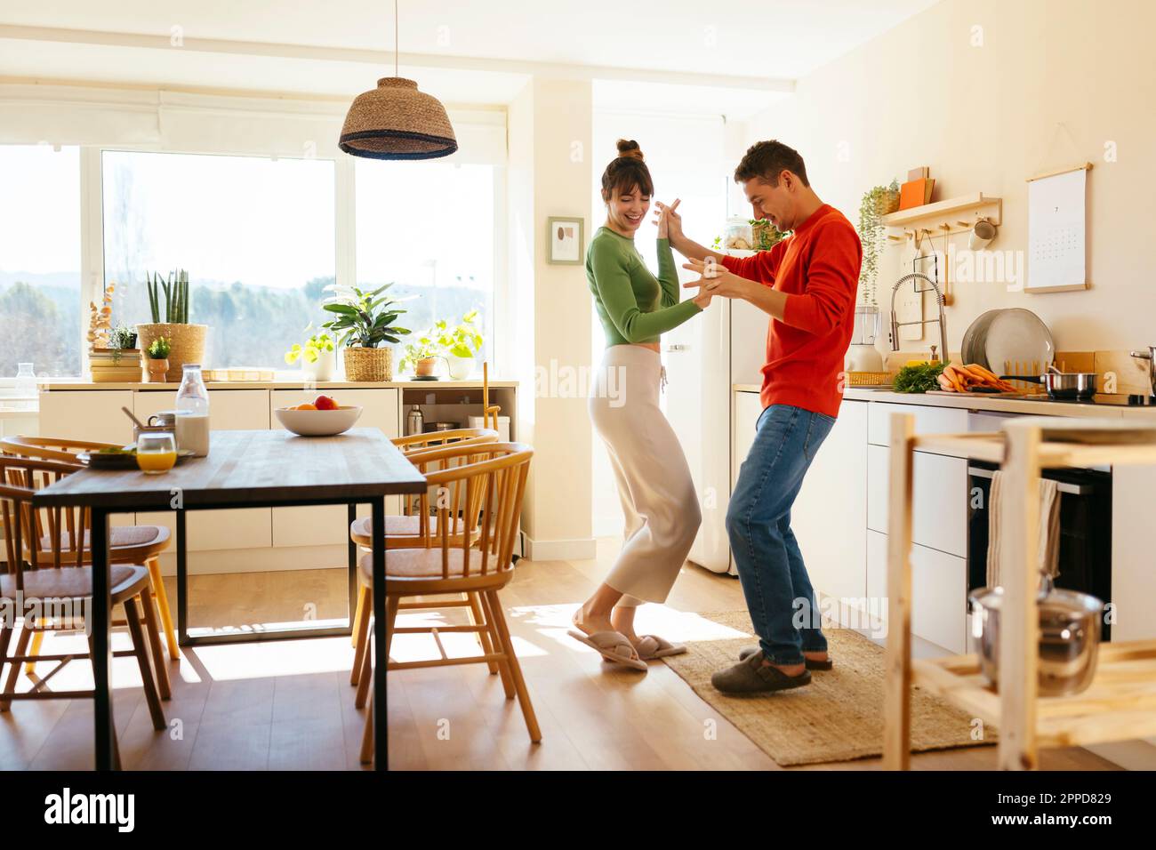 Man woman dancing in kitchen hi-res stock photography and images - Alamy