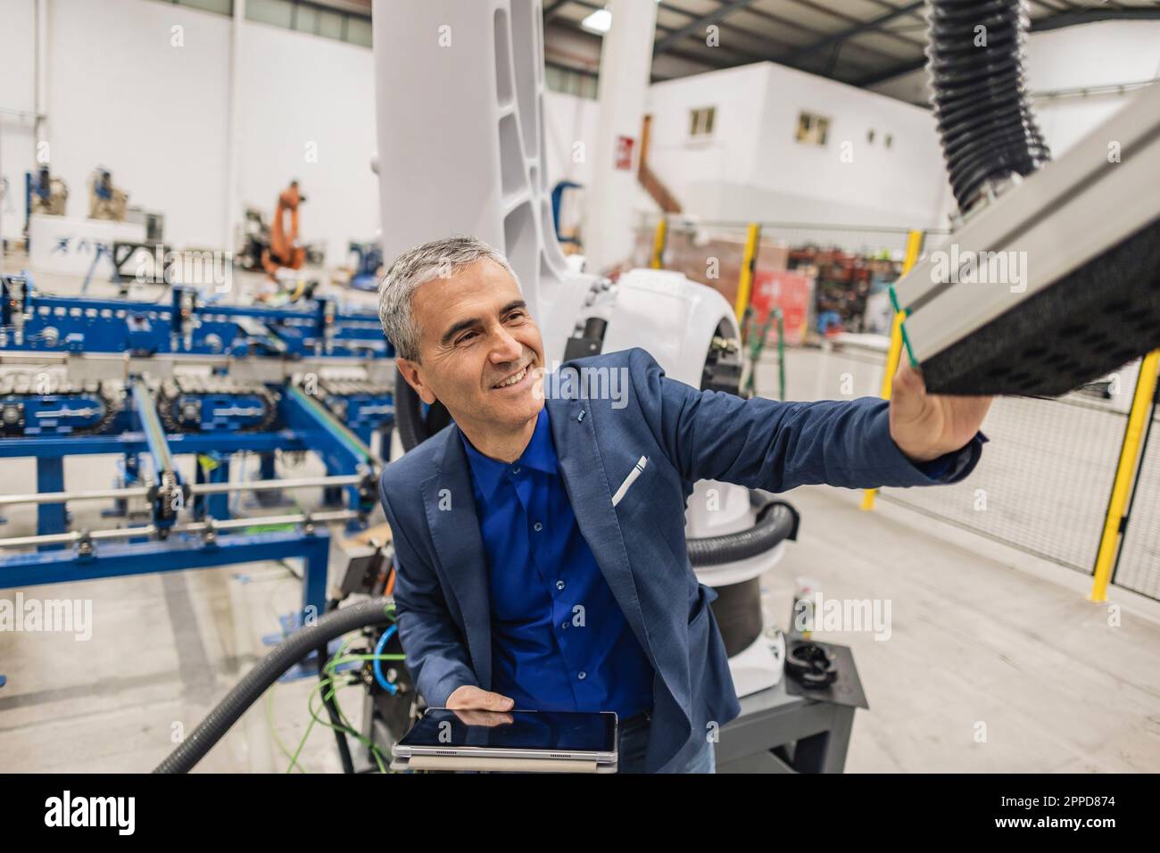 Smiling male engineer arm hi-res stock photography and images - Alamy