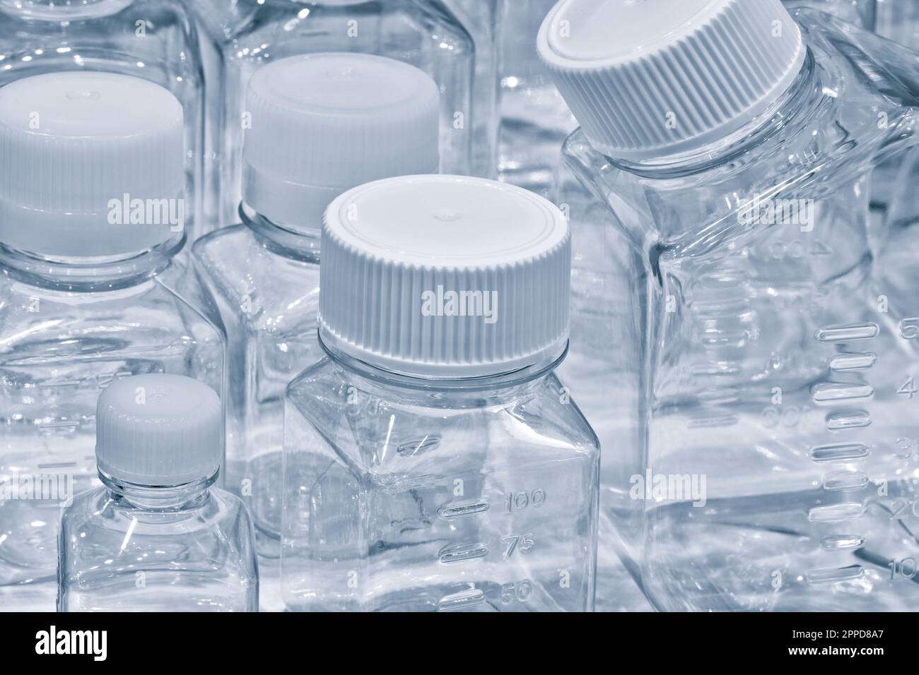 Many small glass or plastic bottles, empty vials Stock Photo - Alamy
