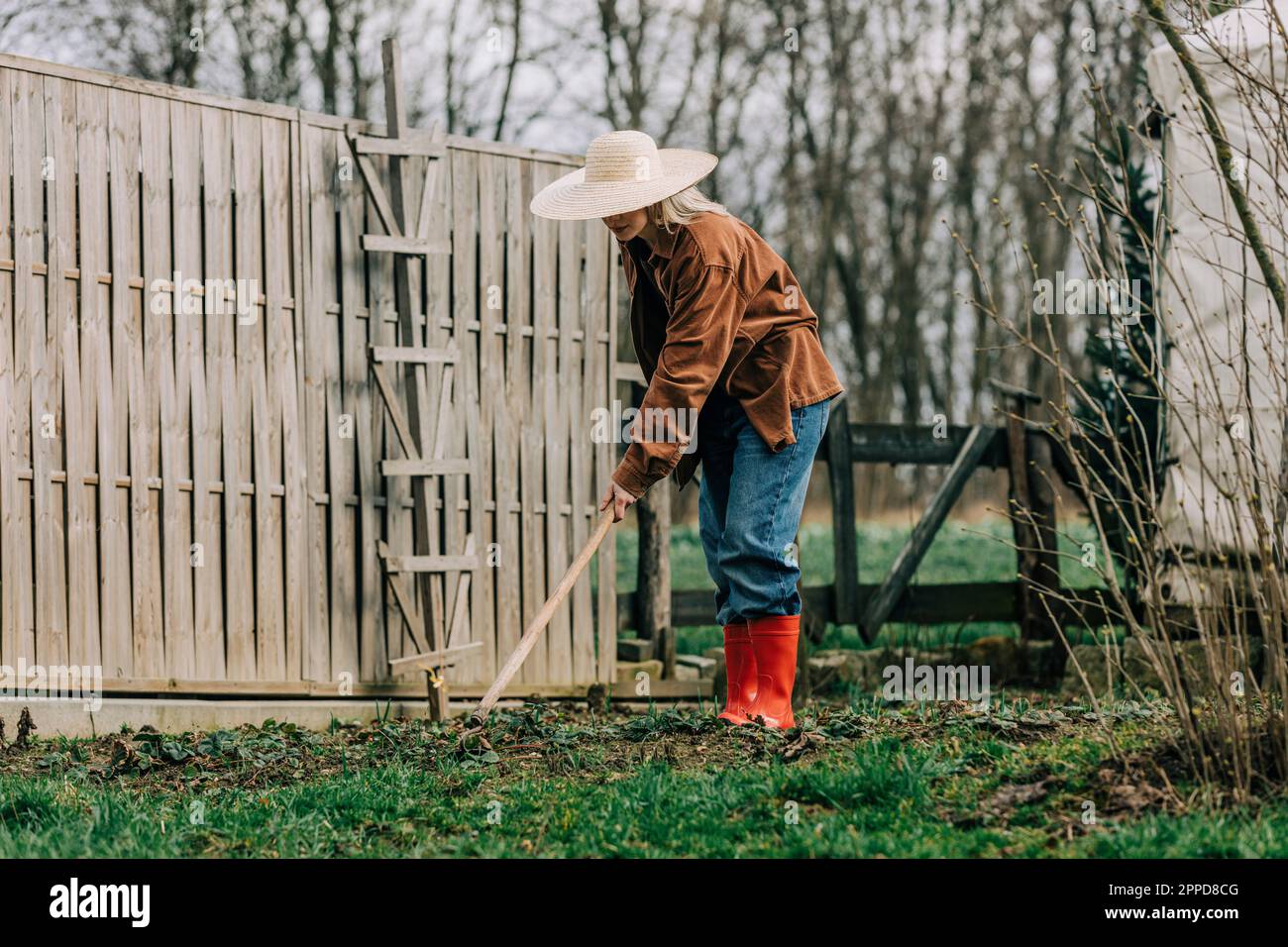 Farmer in his garden with hoe hi-res stock photography and images - Alamy