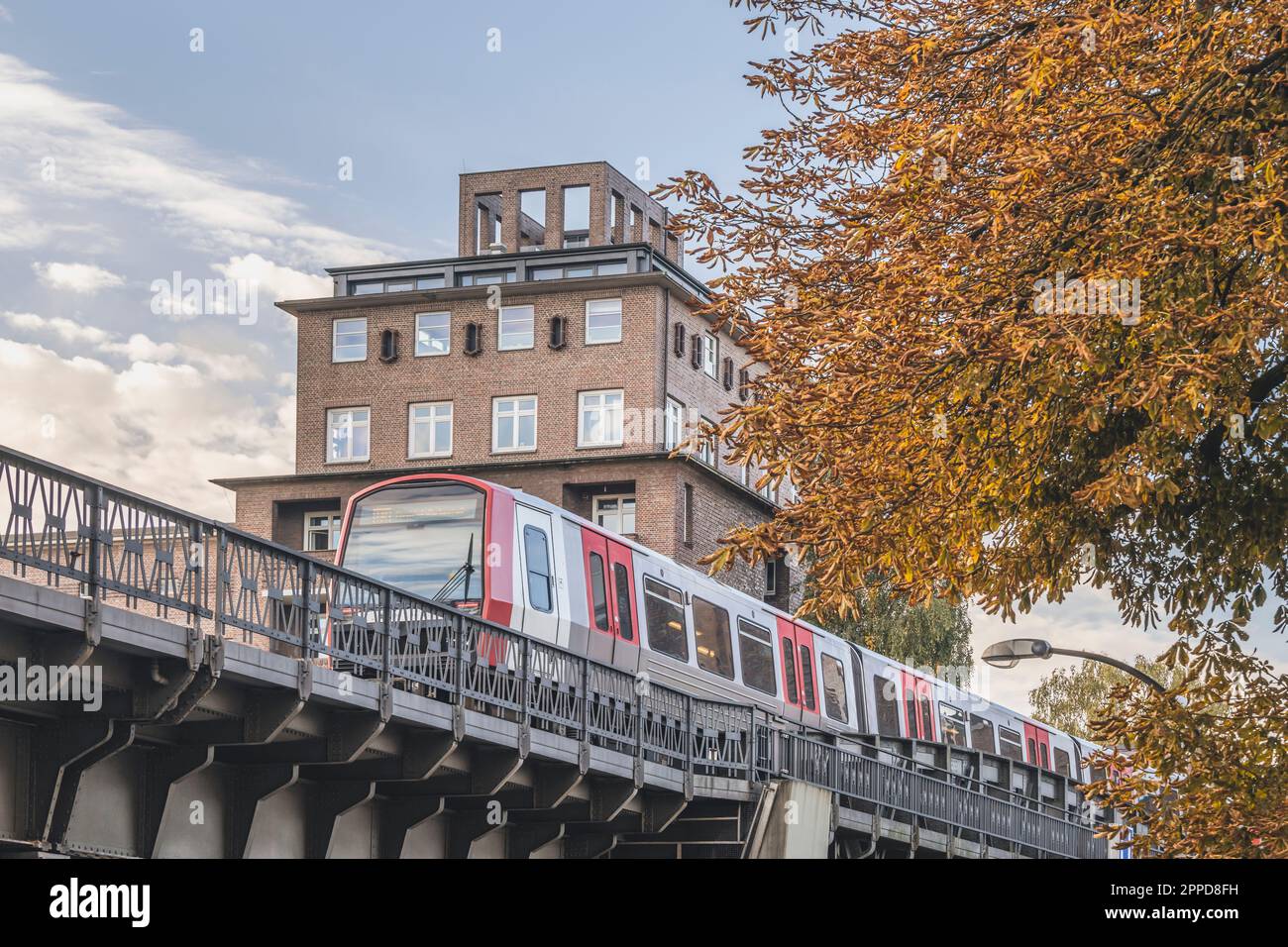 Germany, Hamburg, Subway train passing city bridge in autumn Stock ...