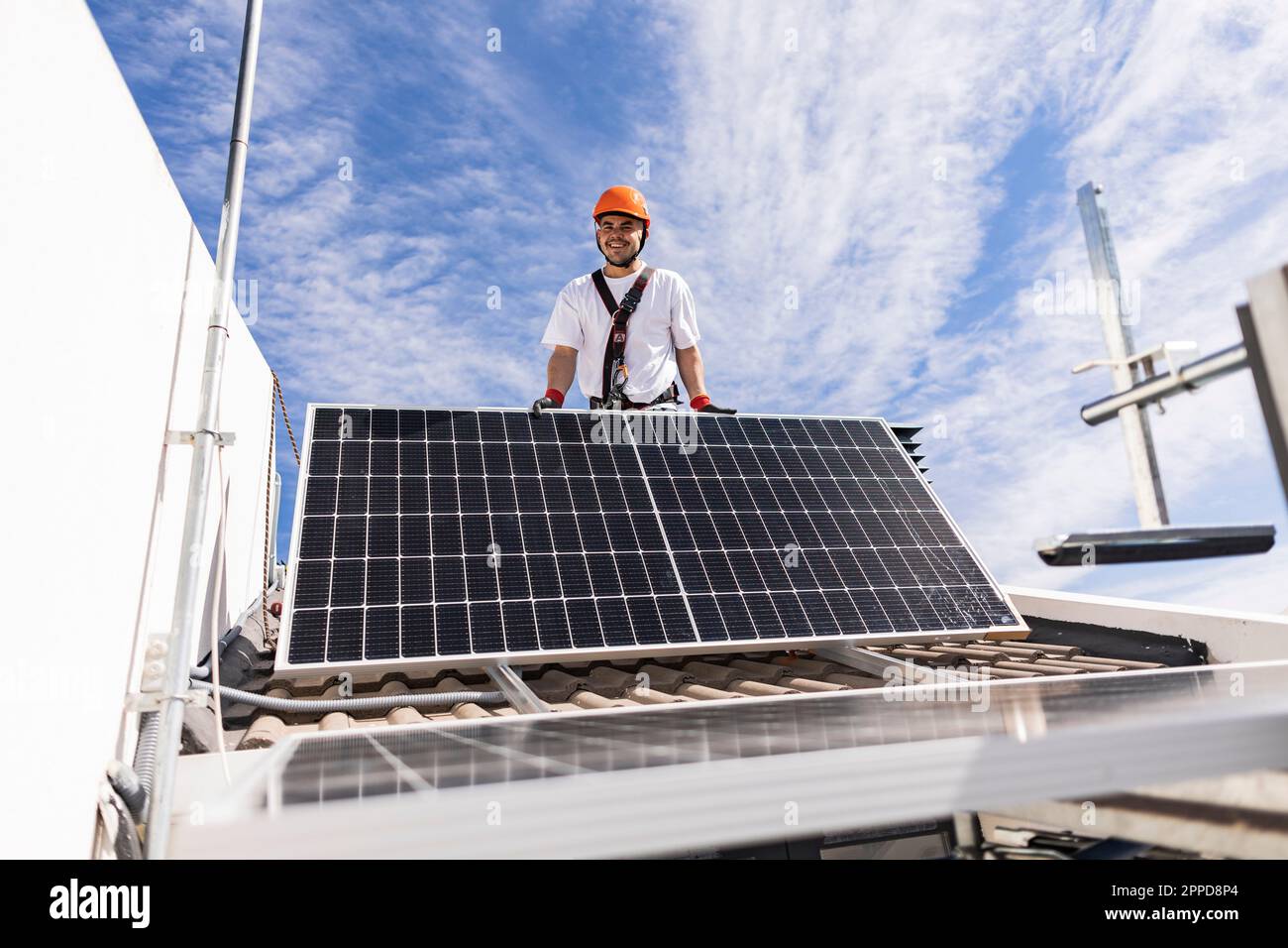 Worker installing roof solar panels hi-res stock photography and images ...
