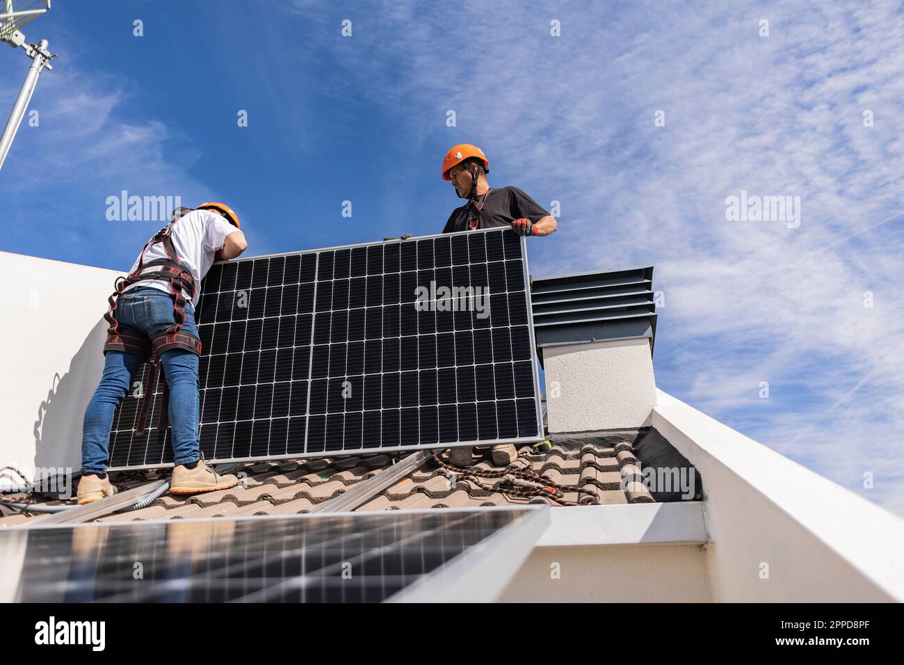Male engineers installing solar panels hi-res stock photography and ...