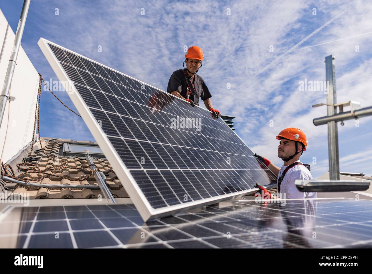 Male engineers installing solar panels hi-res stock photography and ...