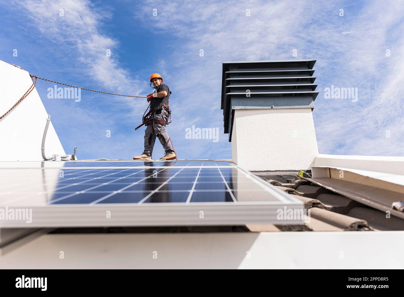 Technician walking on roof hi-res stock photography and images - Alamy