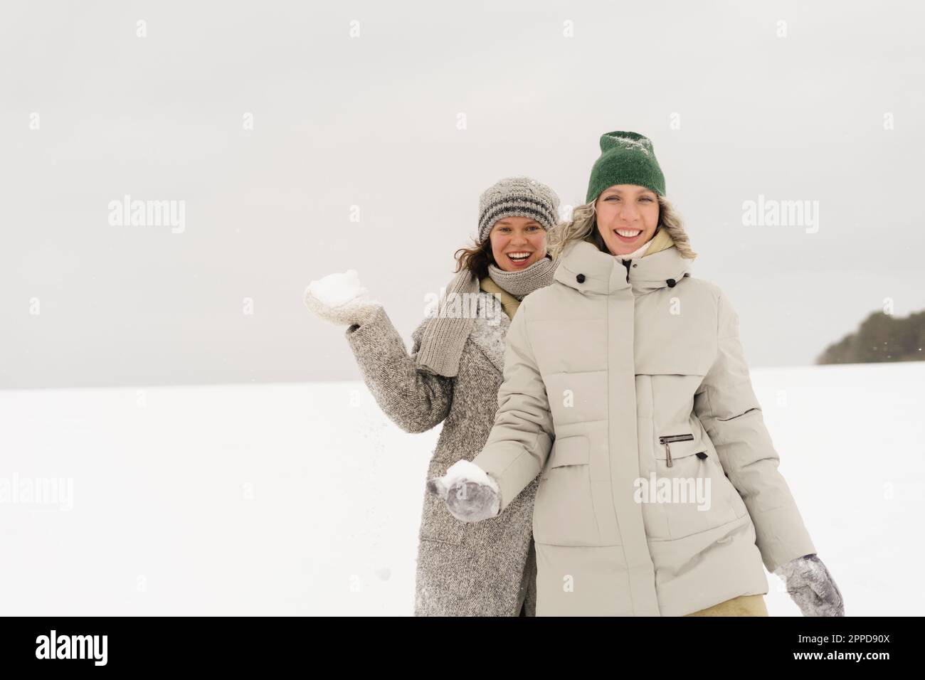 Two women in winter clothes hi-res stock photography and images - Alamy