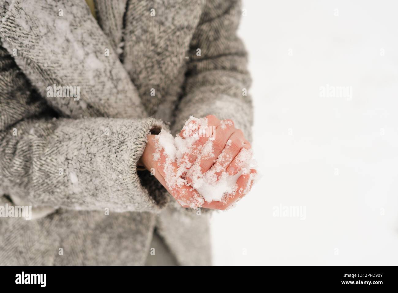 Woman making snowball in hi-res stock photography and images - Alamy