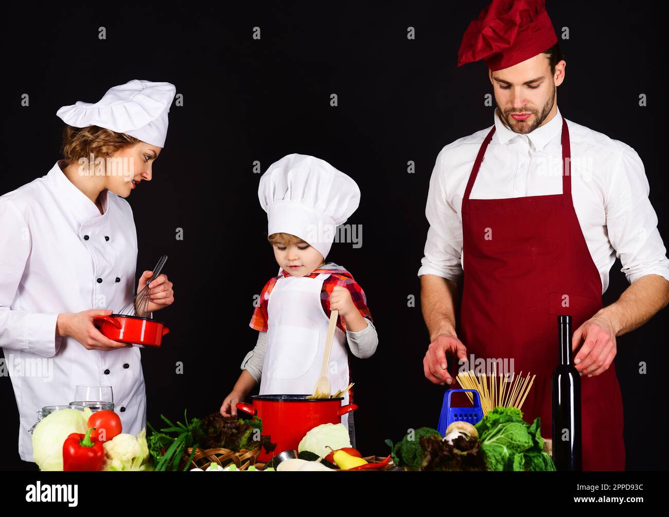 Loving family preparing healthy food together in kitchen. Mother ...