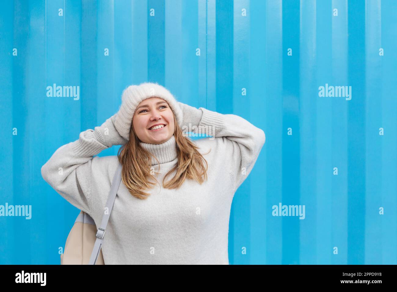 Happy woman wearing blue turtleneck hi-res stock photography and images ...