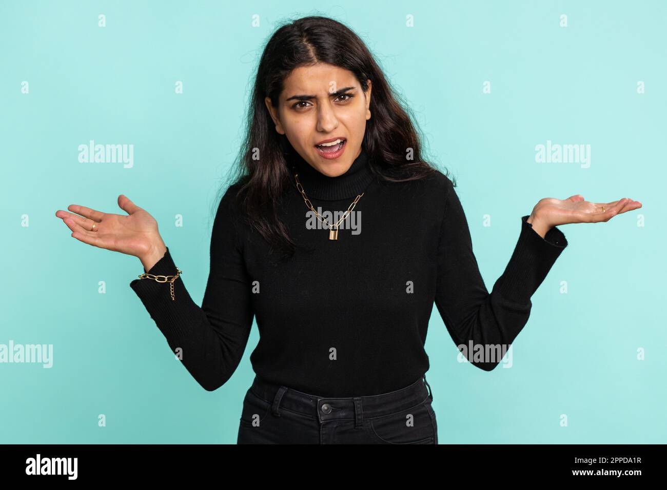 What Why. Sincere irritated indian woman raising hands in indignant ...