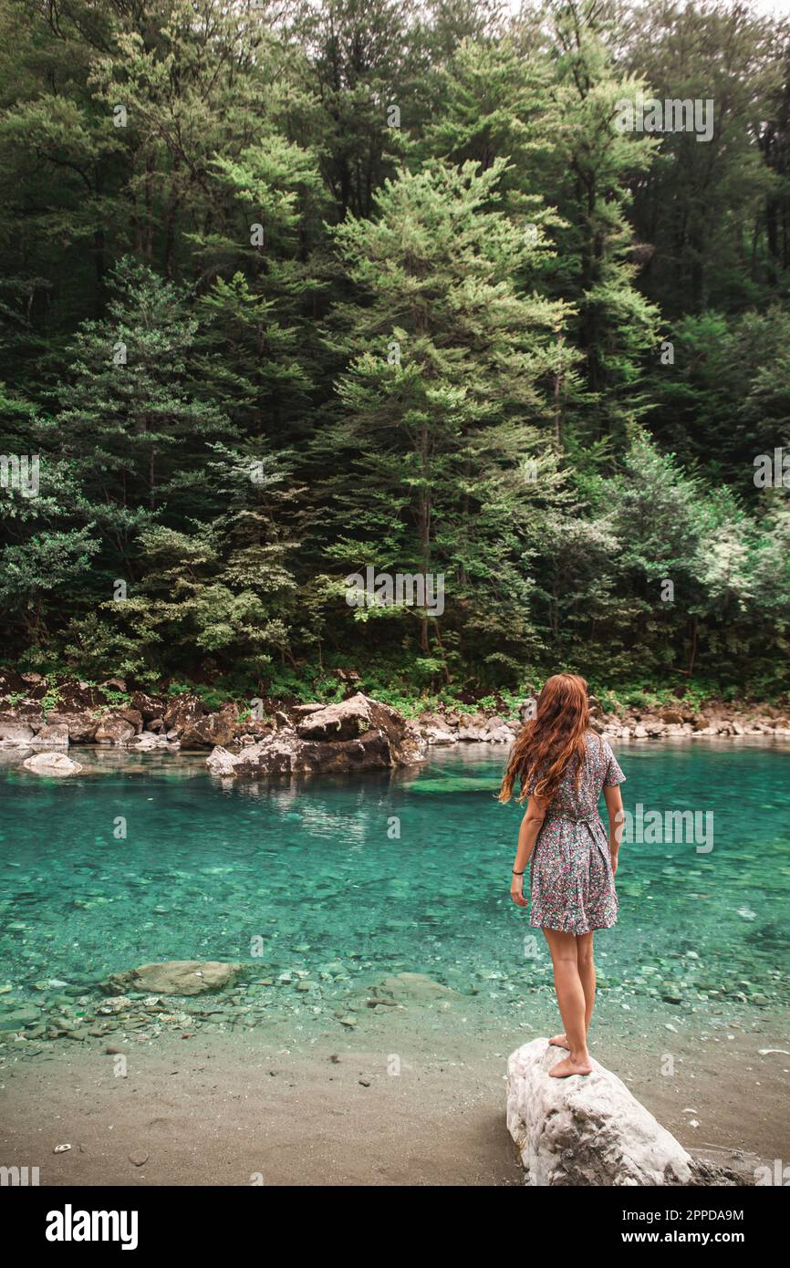 Young woman standing in front rock hi-res stock photography and images ...