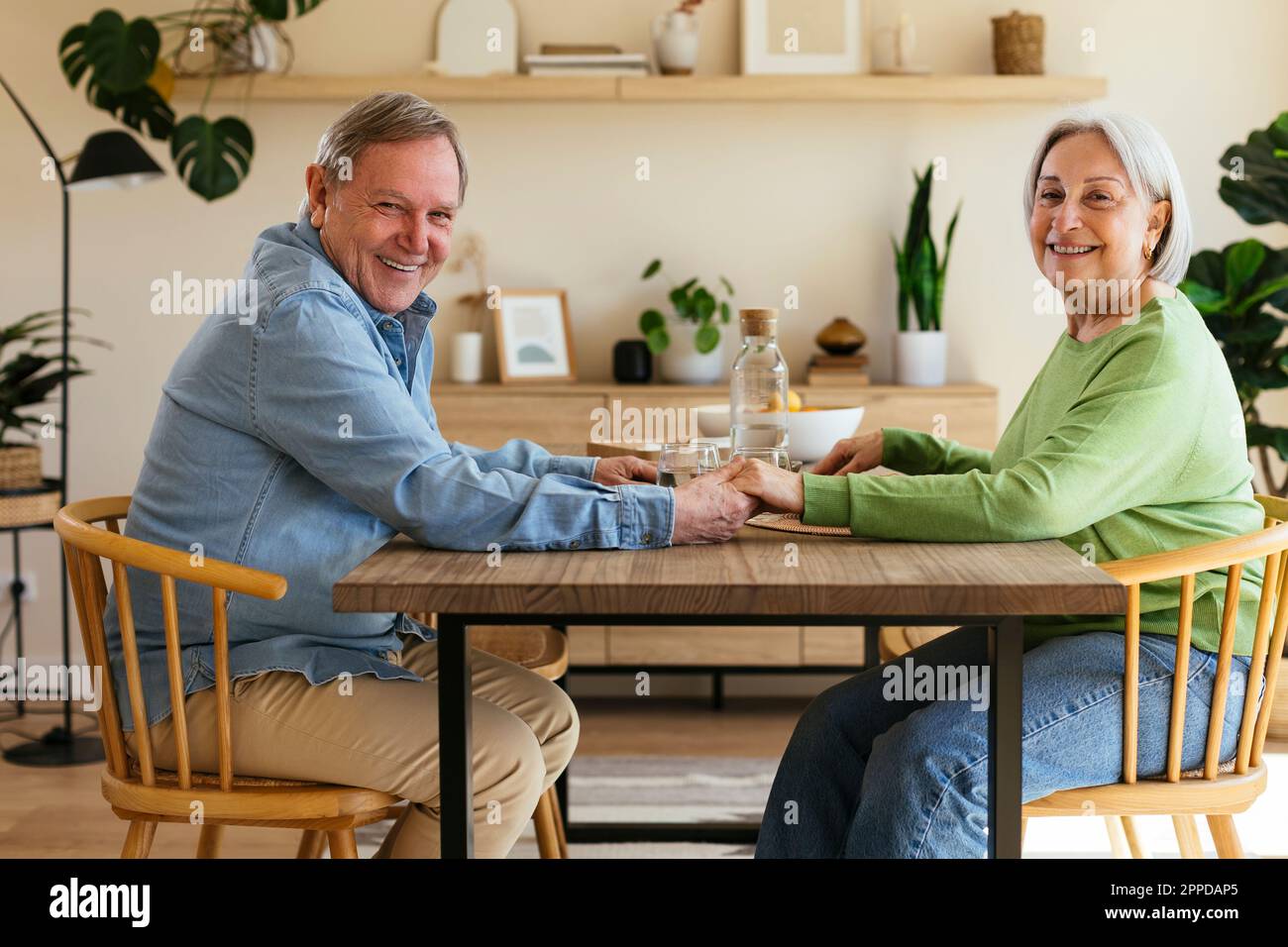 Seniors hands table hi-res stock photography and images - Alamy