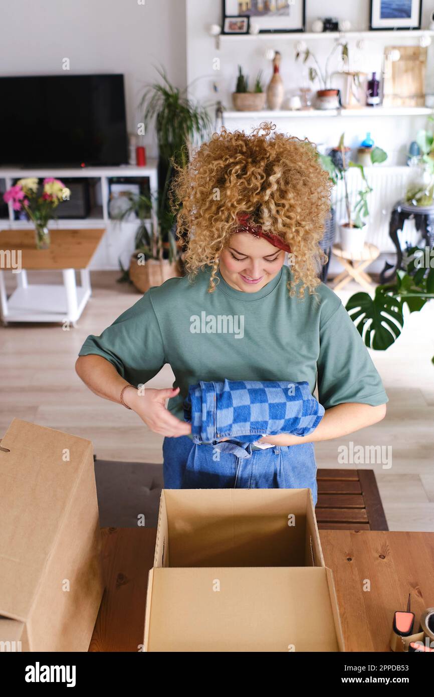 Woman packing cardboard box hi-res stock photography and images - Alamy