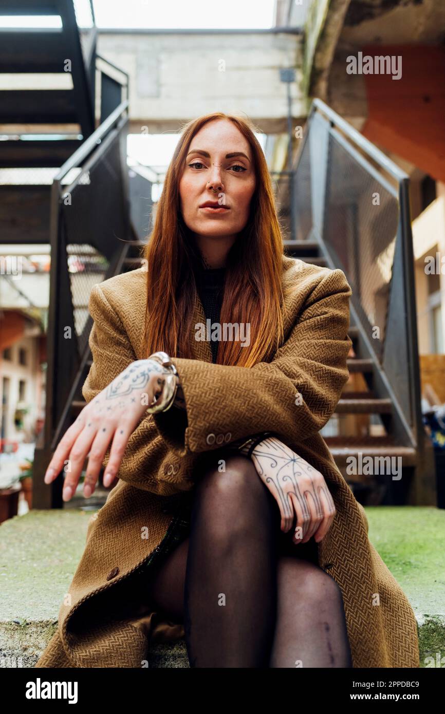 Beautiful redhead woman on stairs hi-res stock photography and images ...