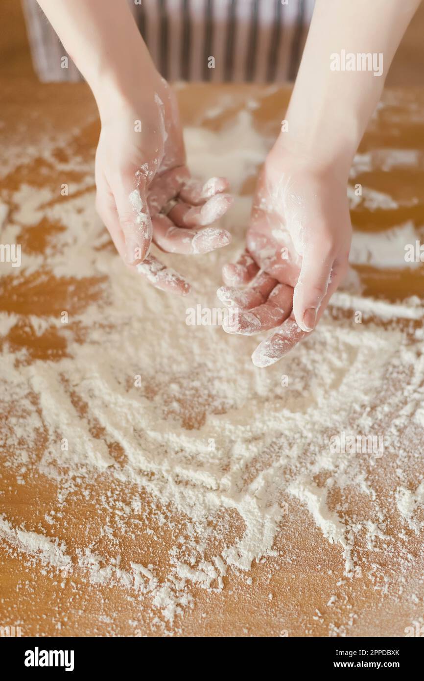 Hands of woman covered in flour Stock Photo - Alamy