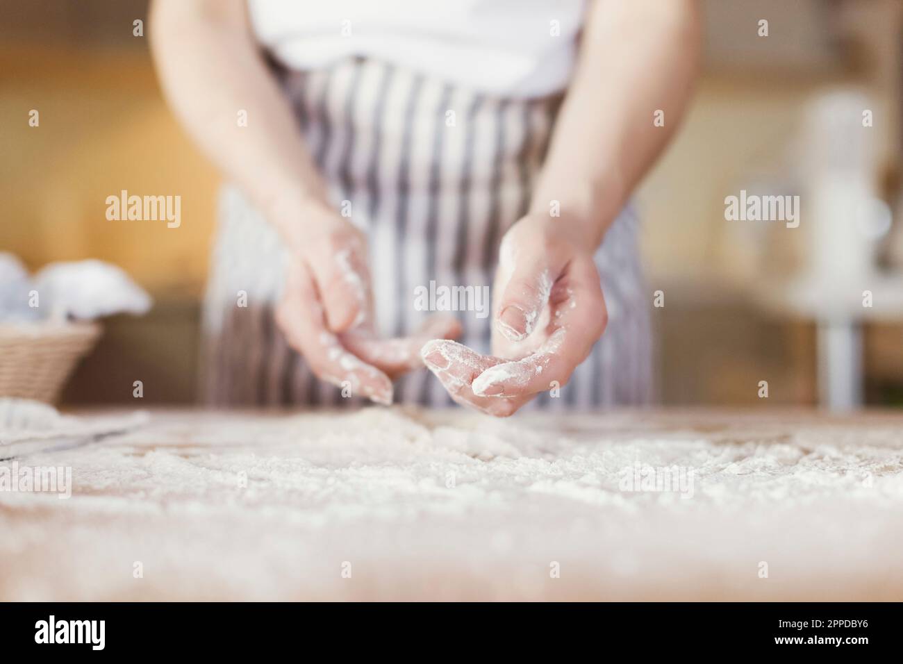 Hands of young woman covered in flour Stock Photo - Alamy