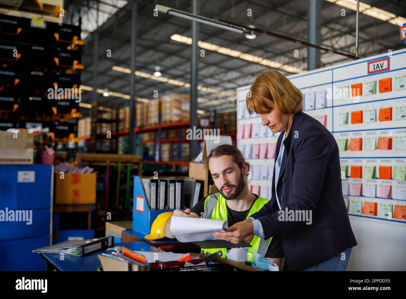 Female warehouse manager checking hi-res stock photography and images ...
