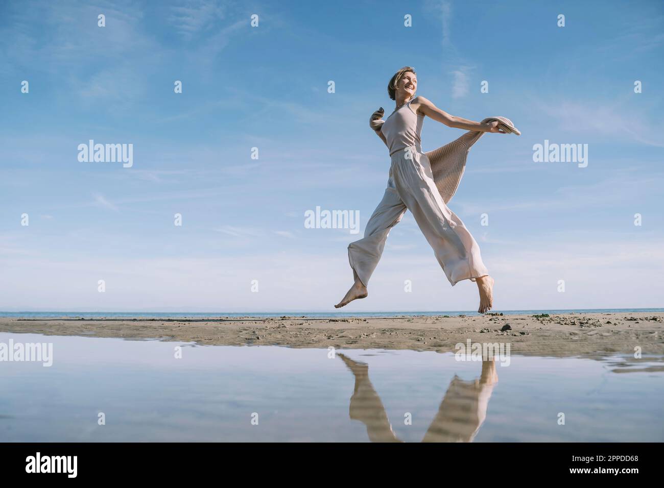 Reflection woman beach hi-res stock photography and images - Alamy
